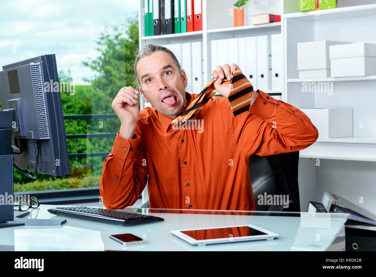 young business man is completely over worked Stock Photo - Alamy