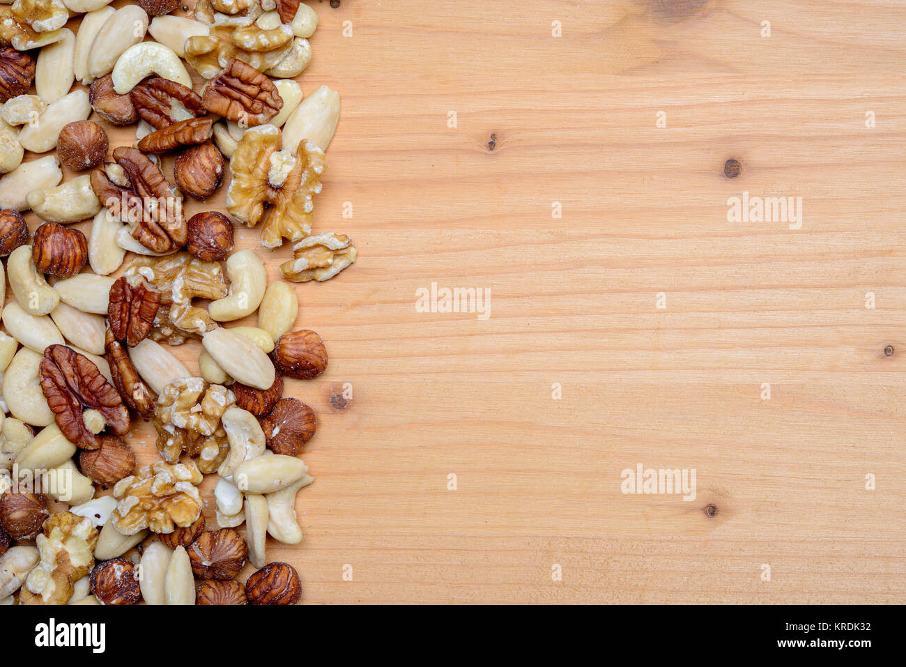 different nuts on wooden ground from above Stock Photo - Alamy