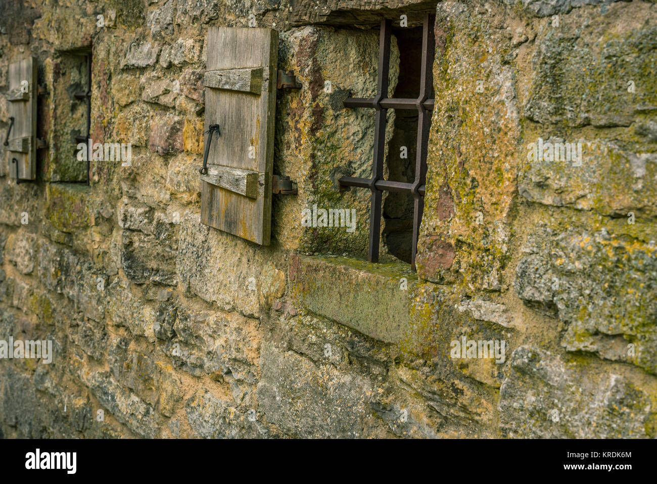 Stone wall with windows Stock Photo - Alamy