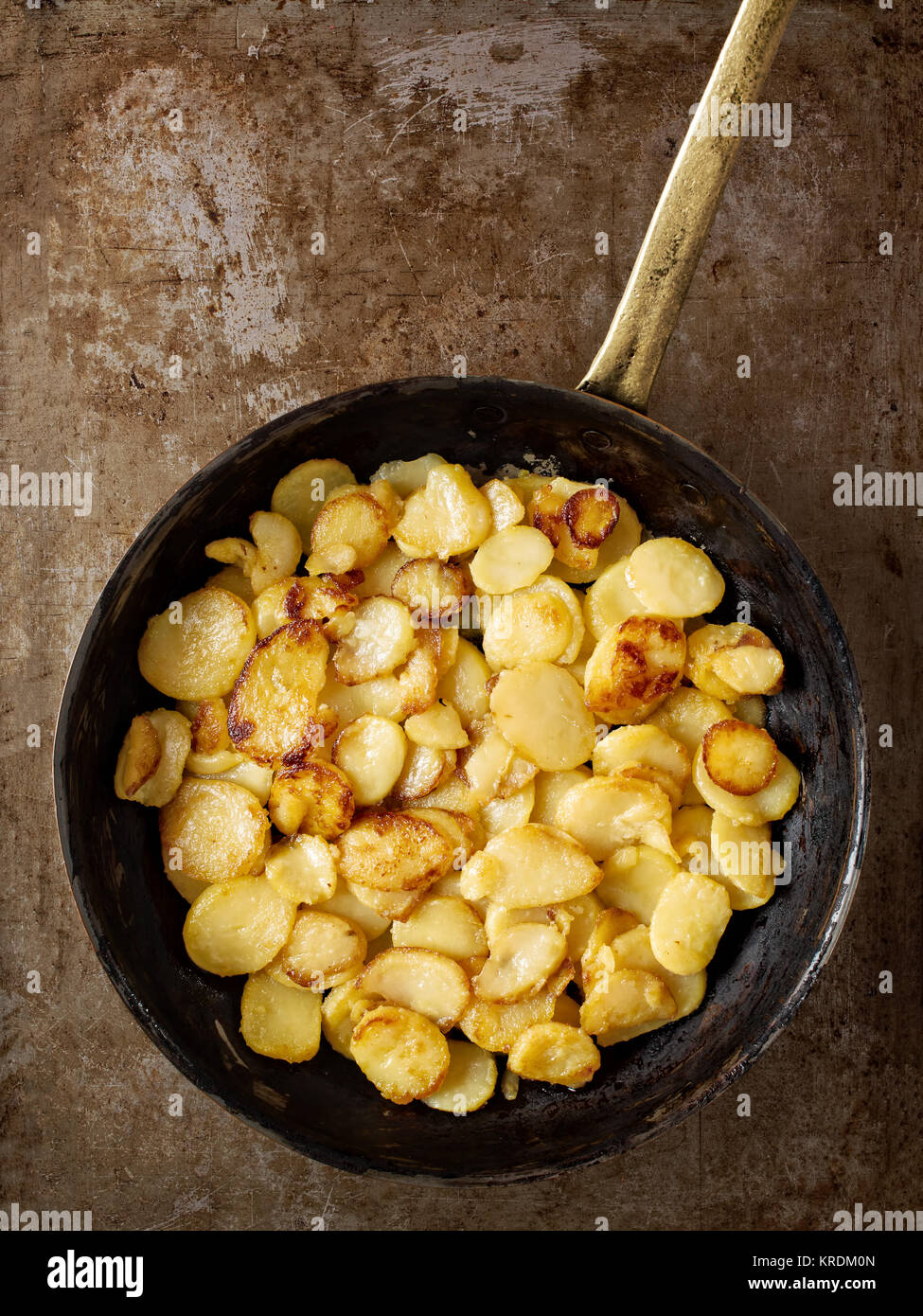 rustic golden german pan fried potato bratkartofflen Stock Photo - Alamy