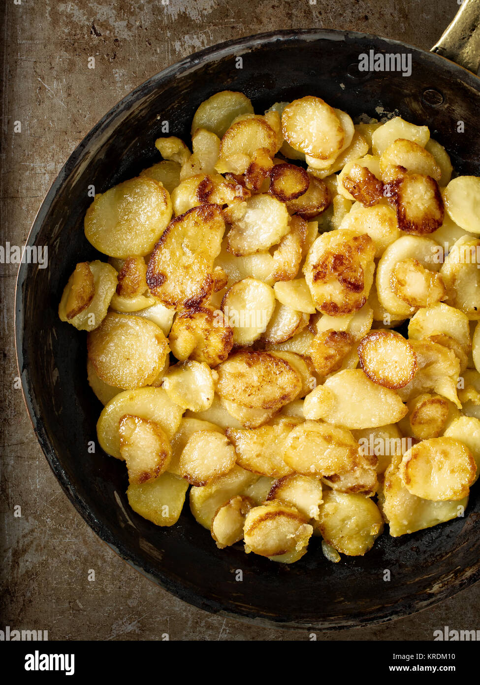rustic golden german pan fried potato bratkartofflen Stock Photo - Alamy