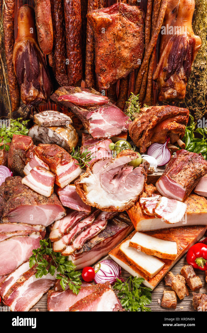 Still life of various smoked pork meat Stock Photo - Alamy