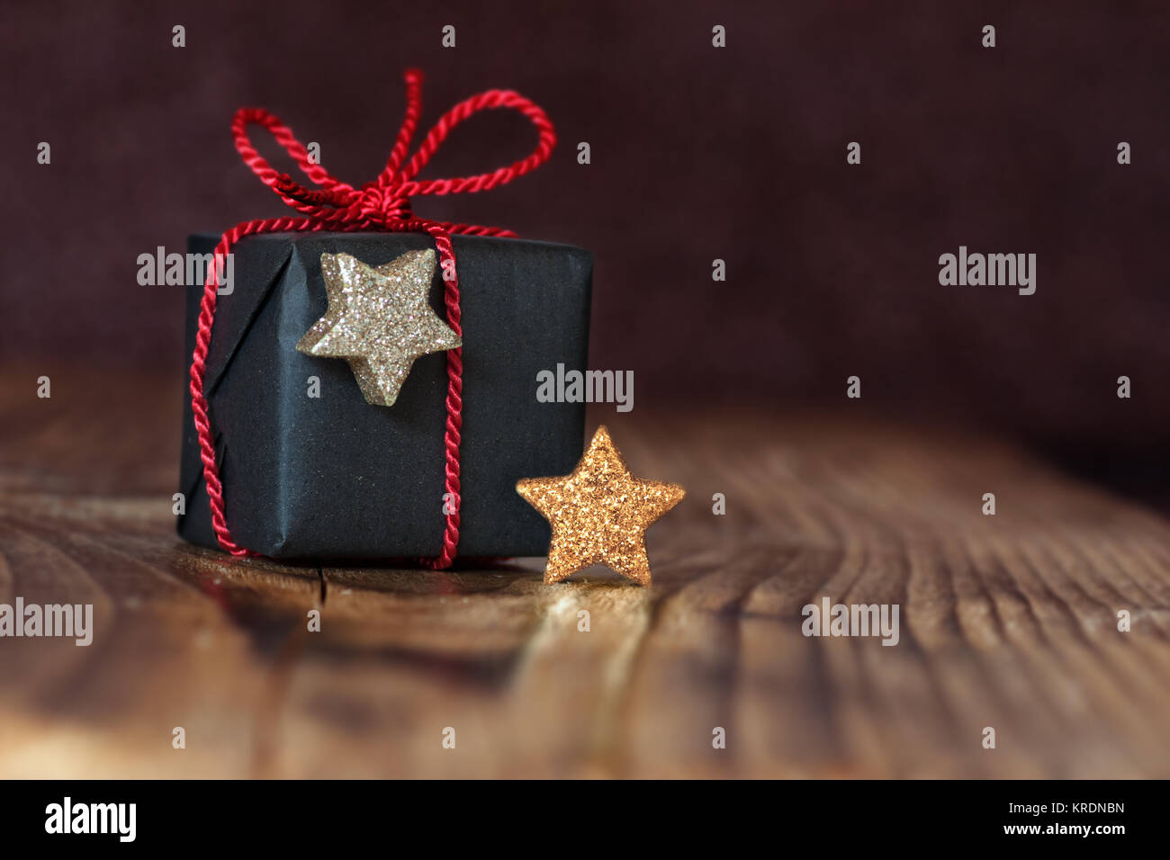 present for christmas with golden and silver stars Stock Photo - Alamy