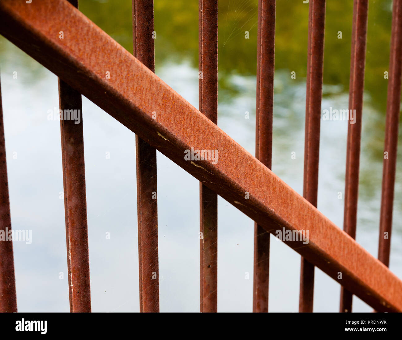 Rusted metal beam diagonal across smaller bars Stock Photo - Alamy