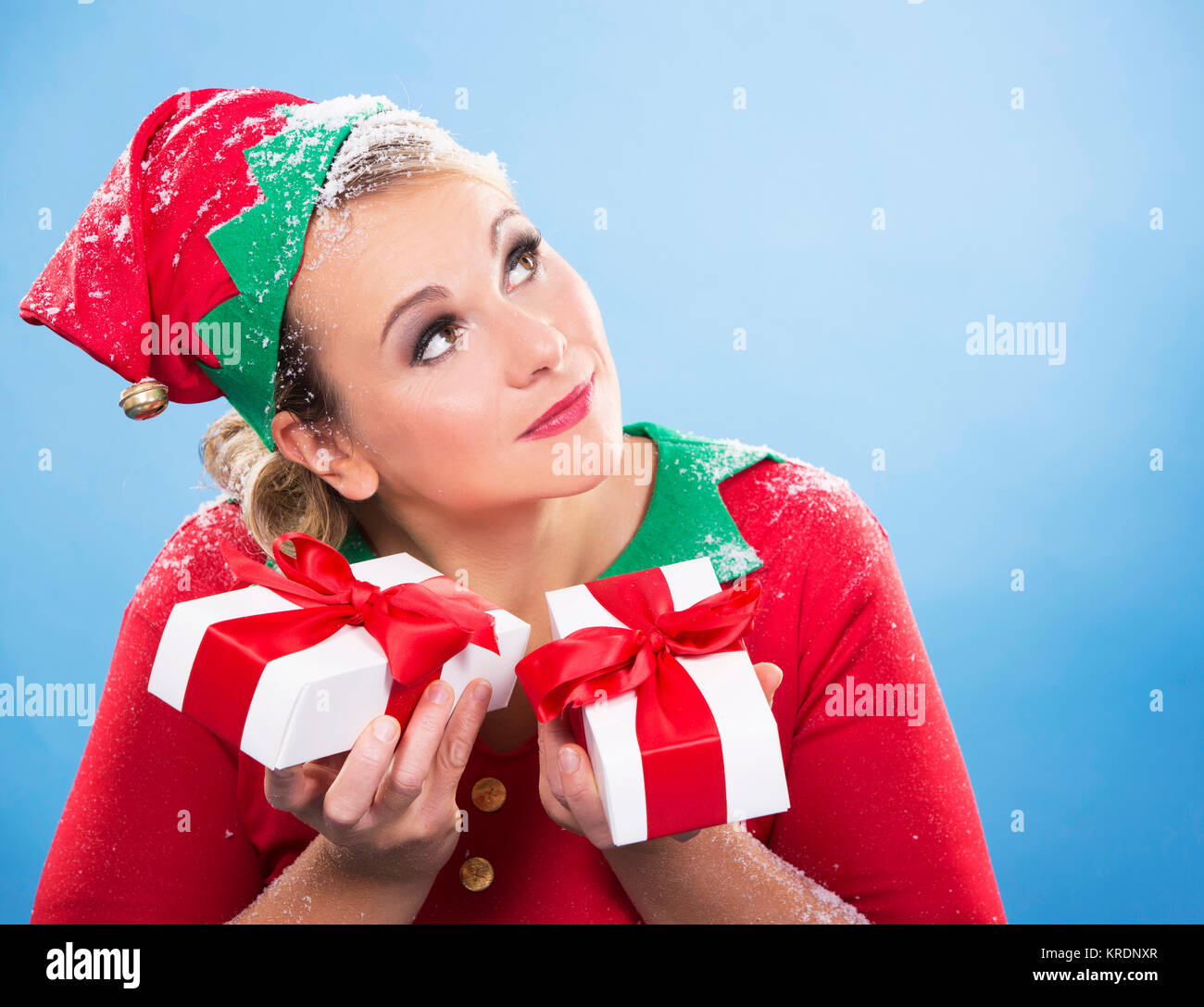blond elf female holding presents Stock Photo - Alamy