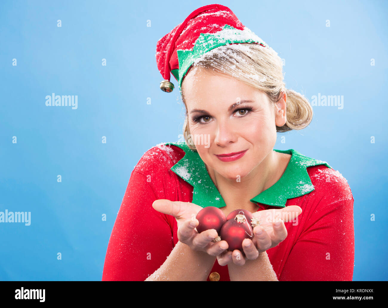 blond elf female holding presents Stock Photo - Alamy
