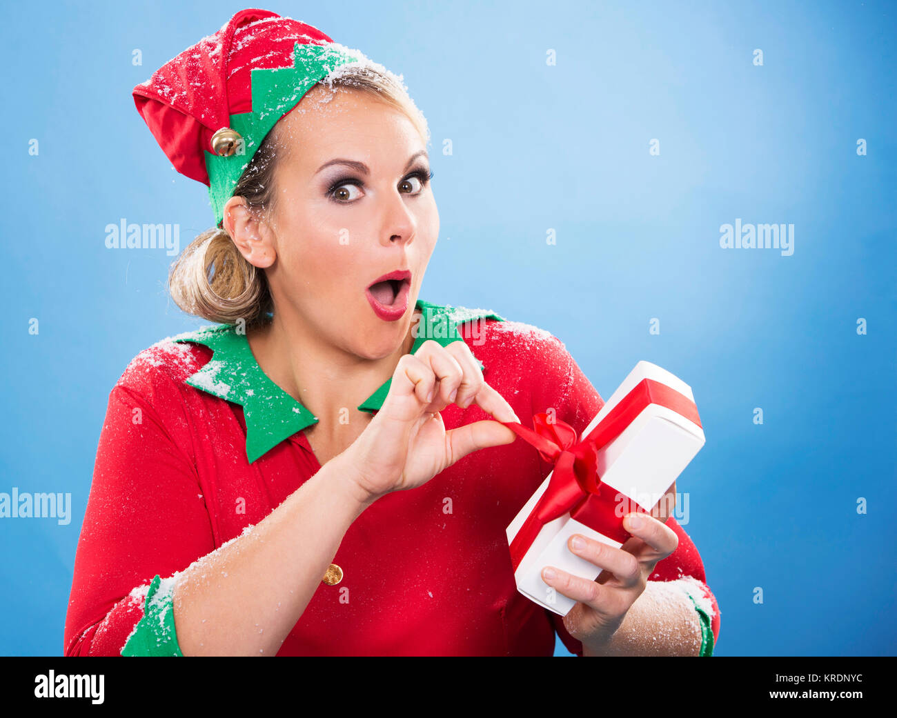 blond elf female holding presents Stock Photo - Alamy