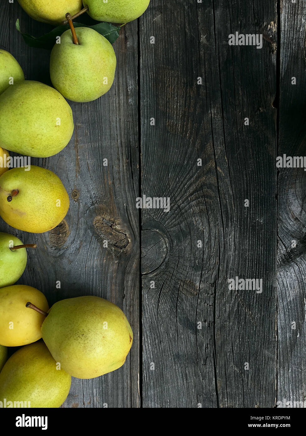 Ripe pears on old wooden background Stock Photo - Alamy