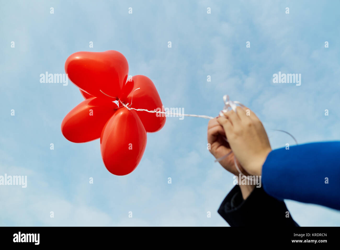 Balloon sky hands hi-res stock photography and images - Alamy