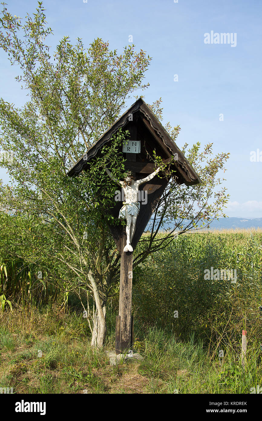 catholic cross with jesus in the wild Stock Photo - Alamy