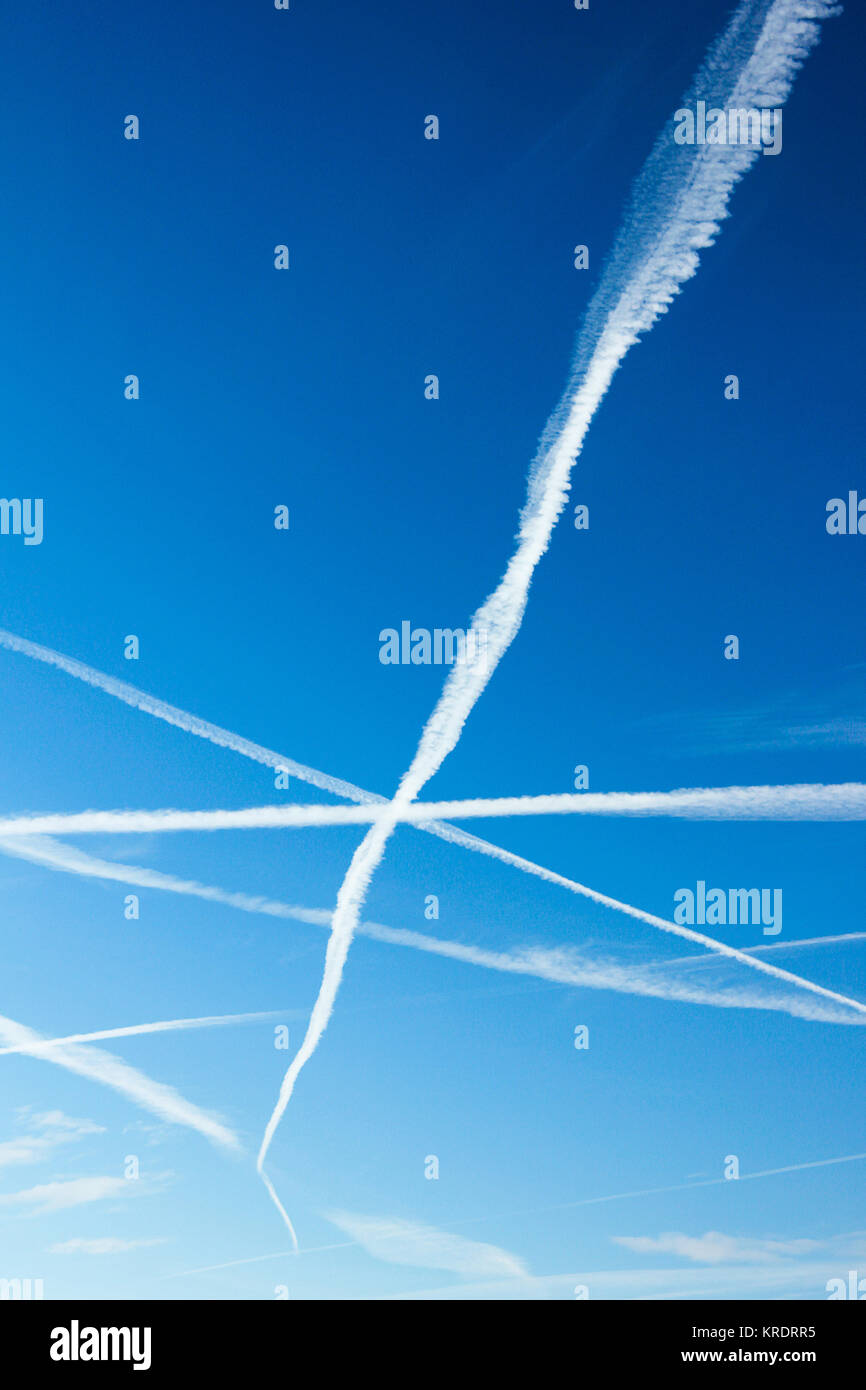 contrails in the blue sky Stock Photo - Alamy