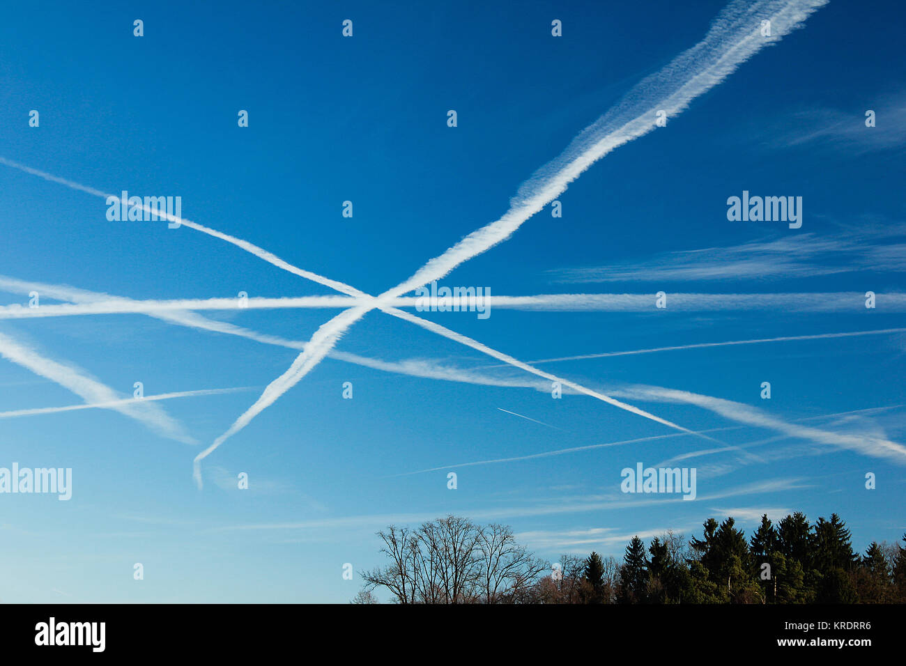 contrails in the blue sky Stock Photo - Alamy