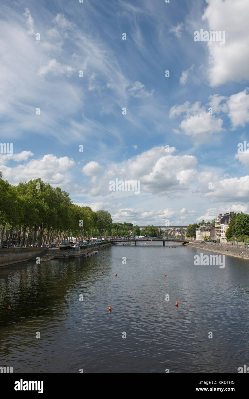 View looking North along the Mayenne River which flows through the town ...