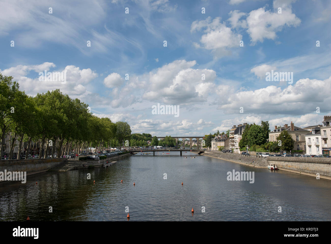 View looking North along the Mayenne River which flows through the town ...
