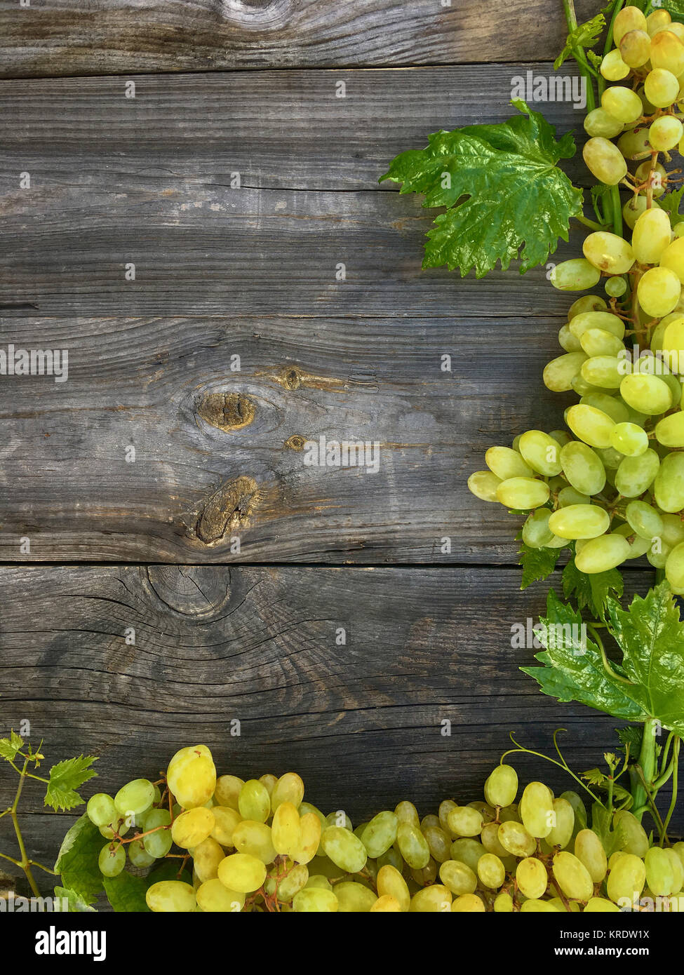 White grape on gray wooden background Stock Photo - Alamy