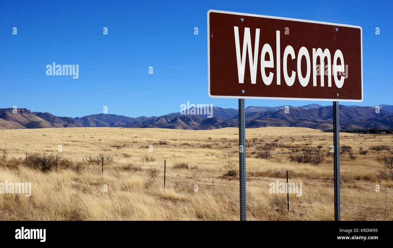 Welcome brown road sign Stock Photo - Alamy