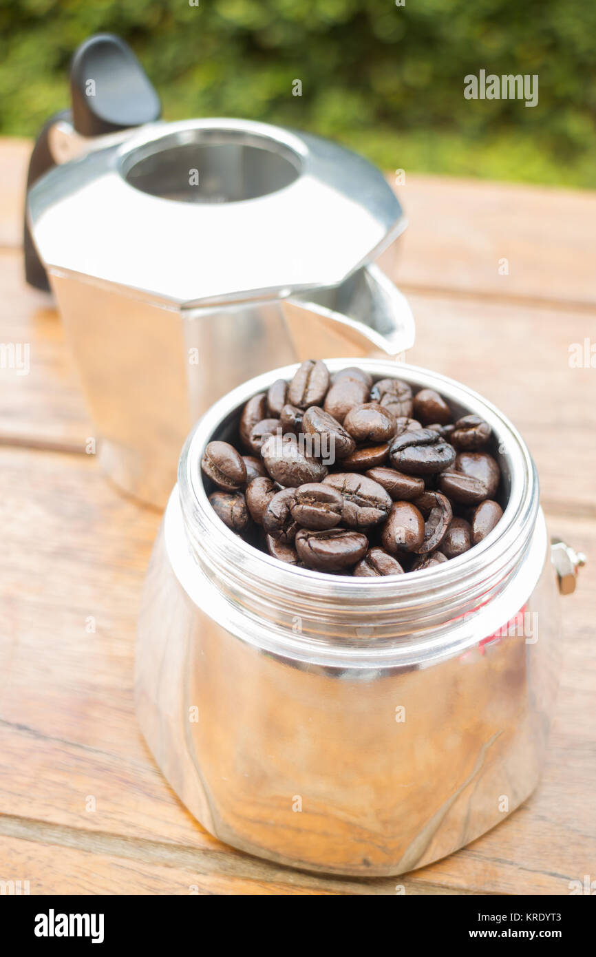 Roasted coffee beans in moka pot Stock Photo - Alamy
