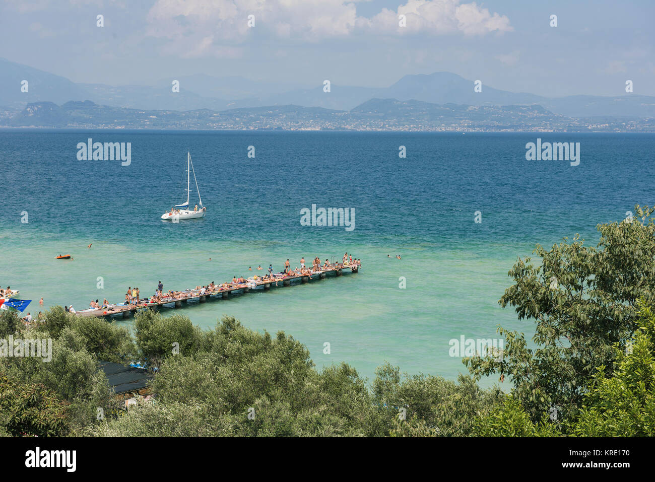 Beautiful beach and blue water in a summer day Stock Photo - Alamy