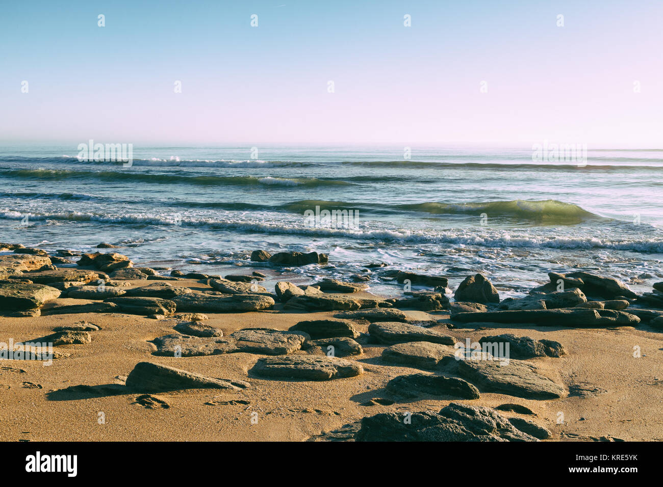 Large limestone deposits on the shore of a beach. Rocky coastline Stock ...