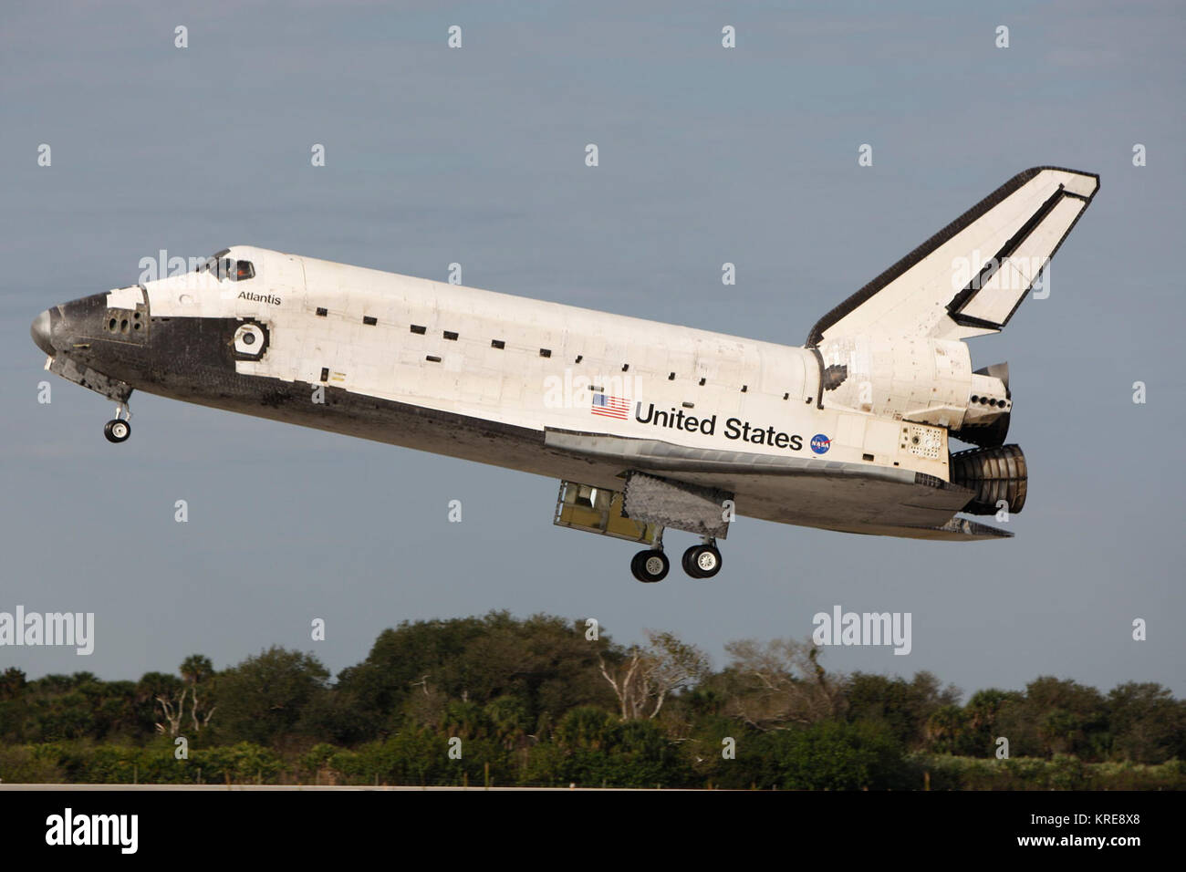 Space Shuttle Atlantis approaching the Kennedy Space Center to land ...