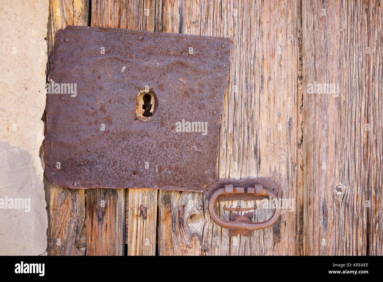 Detail of an old lock on a wooden door Stock Photo - Alamy