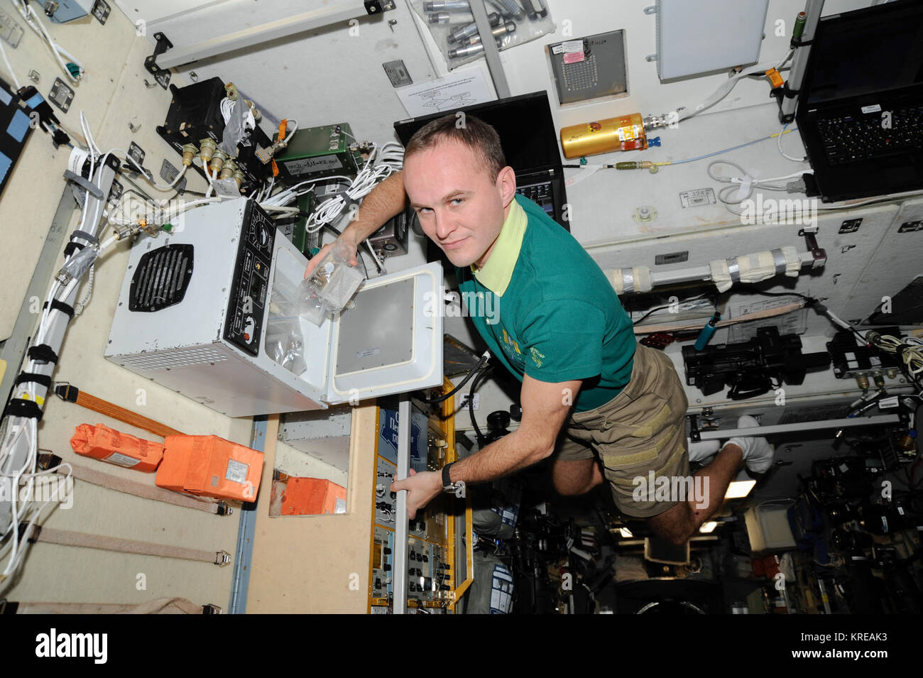 ISS-37 Sergey Ryazansky with a Bioreactor for the CASKAD experiment ...