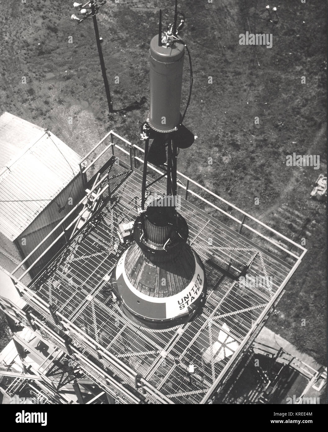 THIS PHOTOGRAPH DEPICTS INSTALLATION OF THE MERCURY CAPSULE AND ESCAPE ...