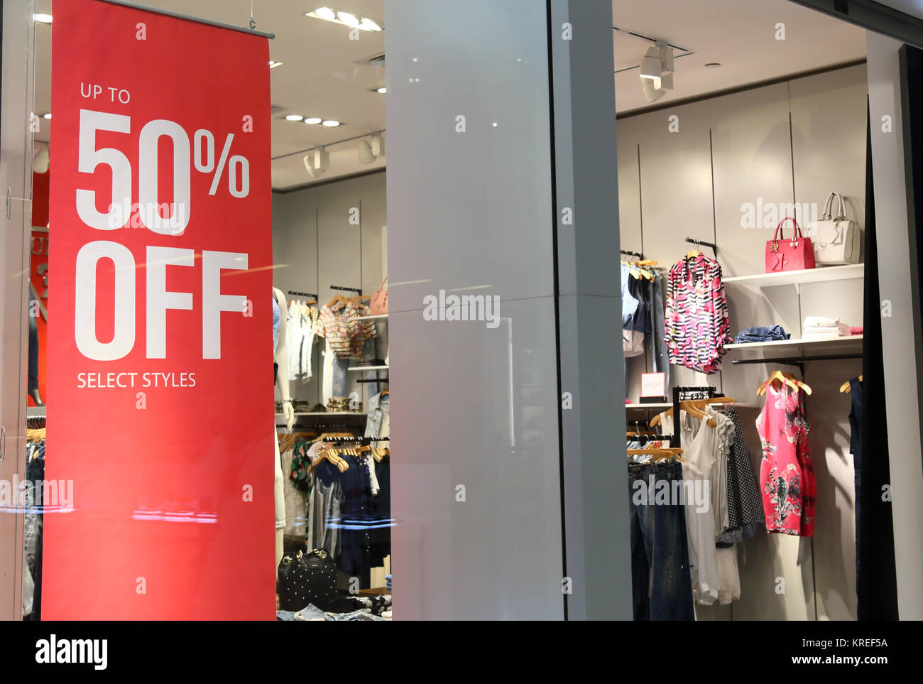 sale sign on shop display Stock Photo - Alamy