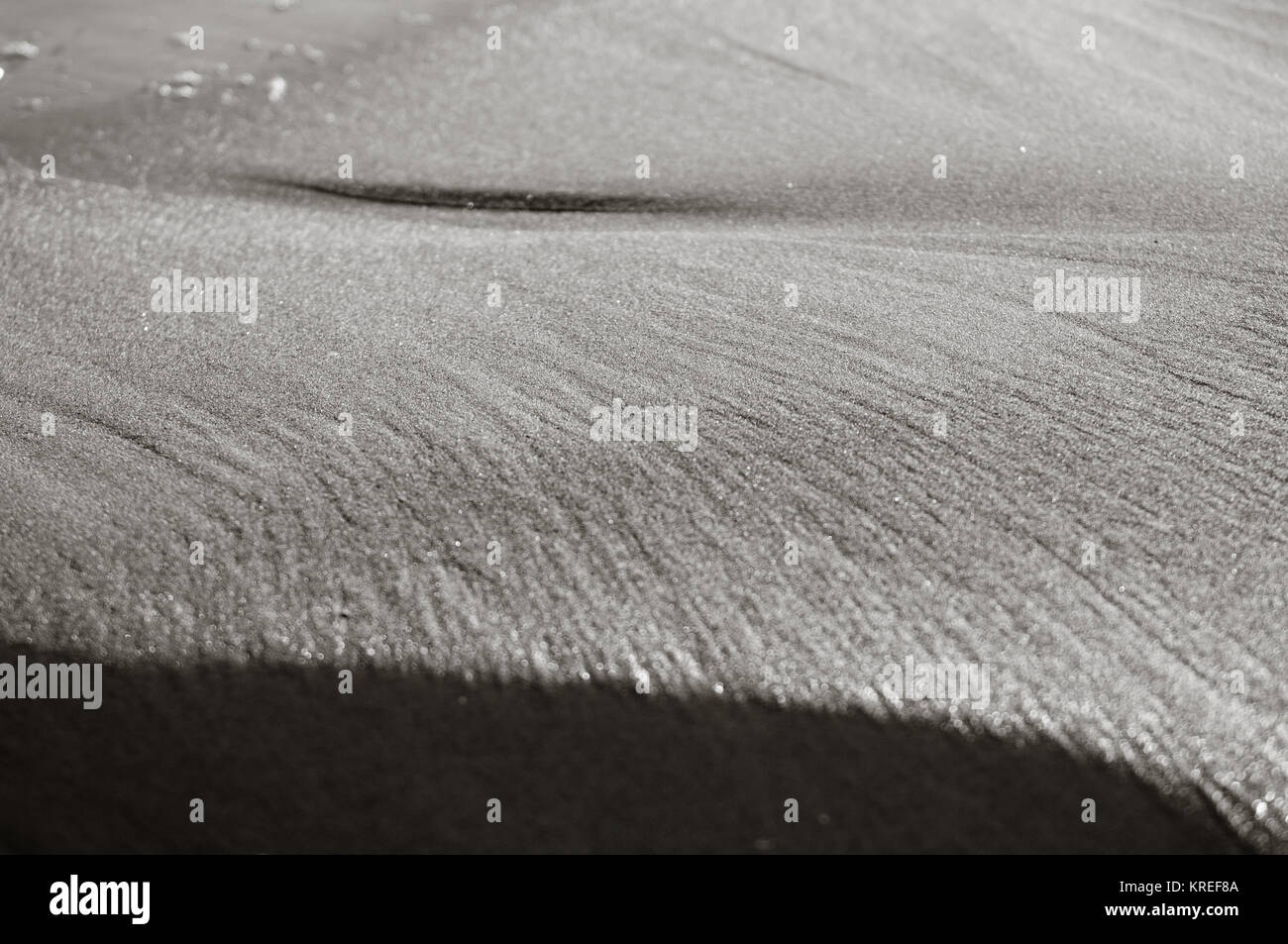 Waves of sand formed by water Stock Photo - Alamy