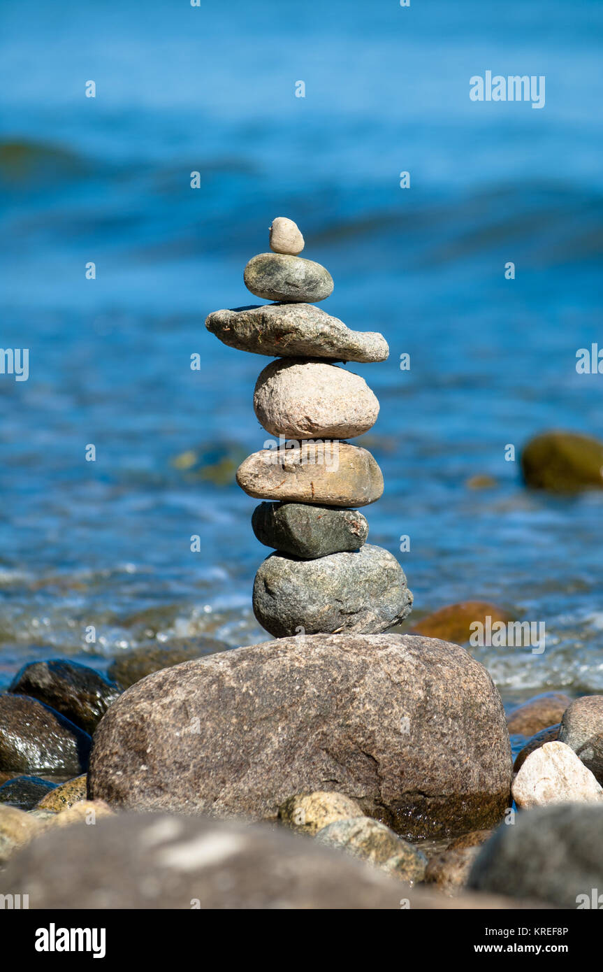 Stone tower on a pebble beach Stock Photo - Alamy