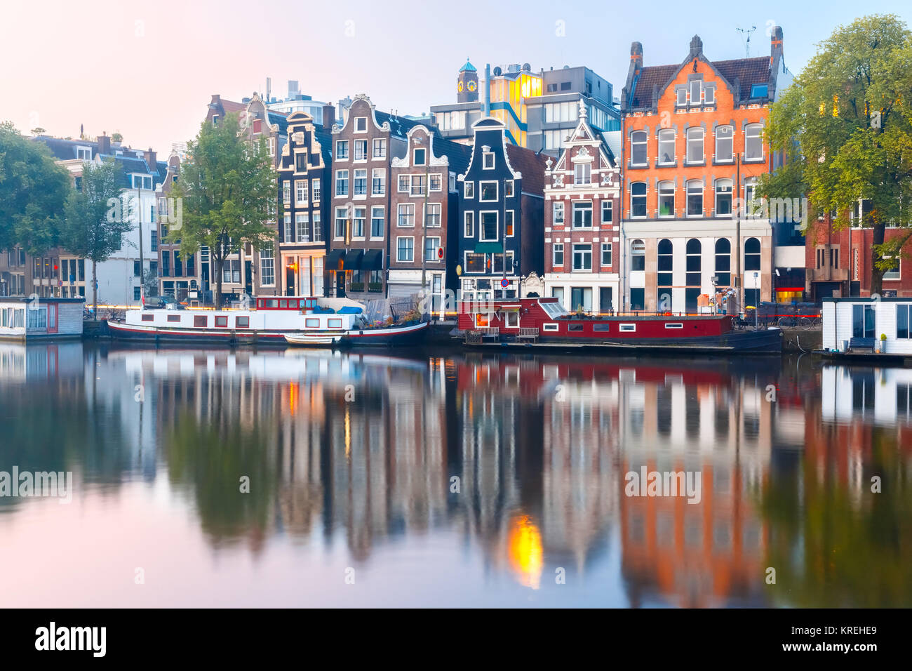 Night city view of Amsterdam canal with dutch houses Stock Photo - Alamy