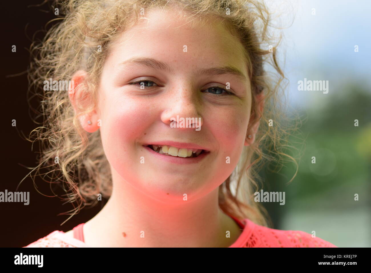 Picture of a girl looking happy Stock Photo - Alamy