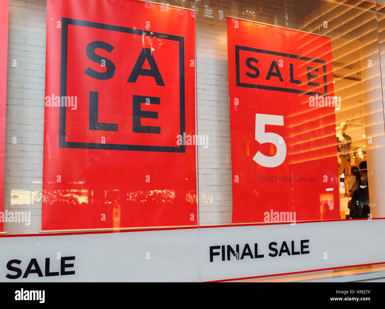 sale sign on shop display Stock Photo - Alamy