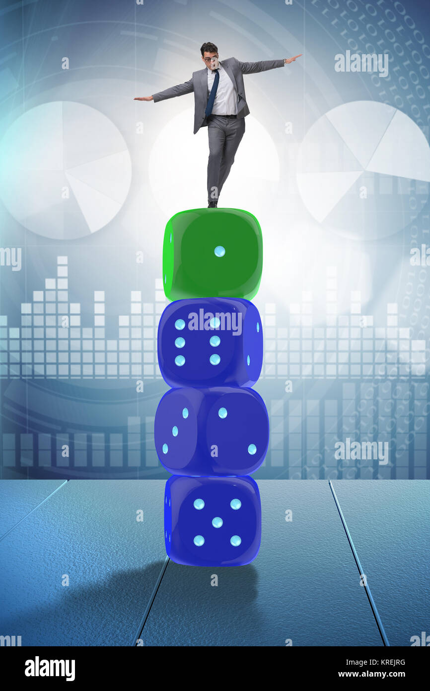 Businessman balancing on top of dice stack in uncertainty concept Stock ...