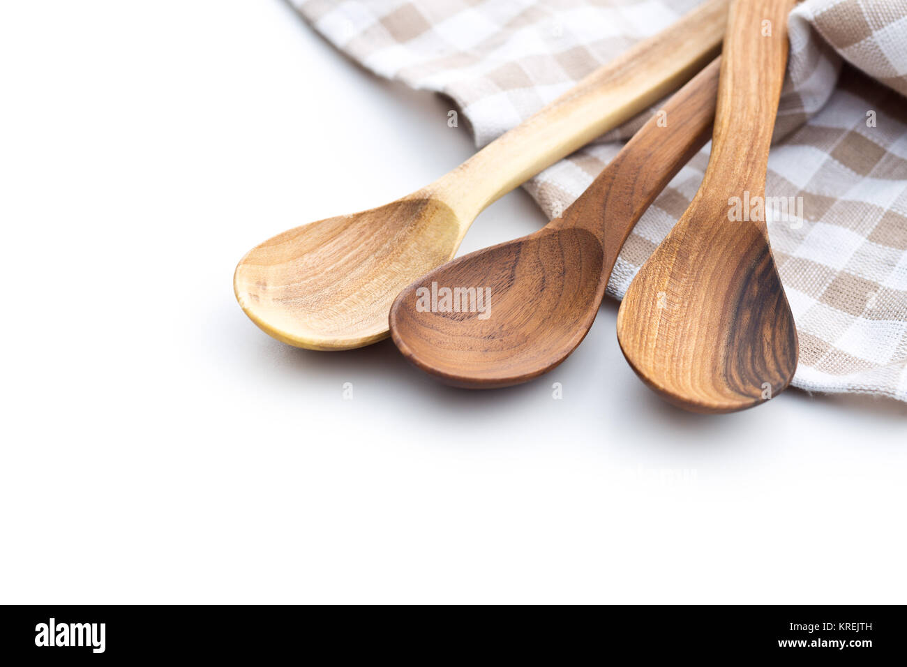 Three wooden spoons and checkered napkin Stock Photo - Alamy