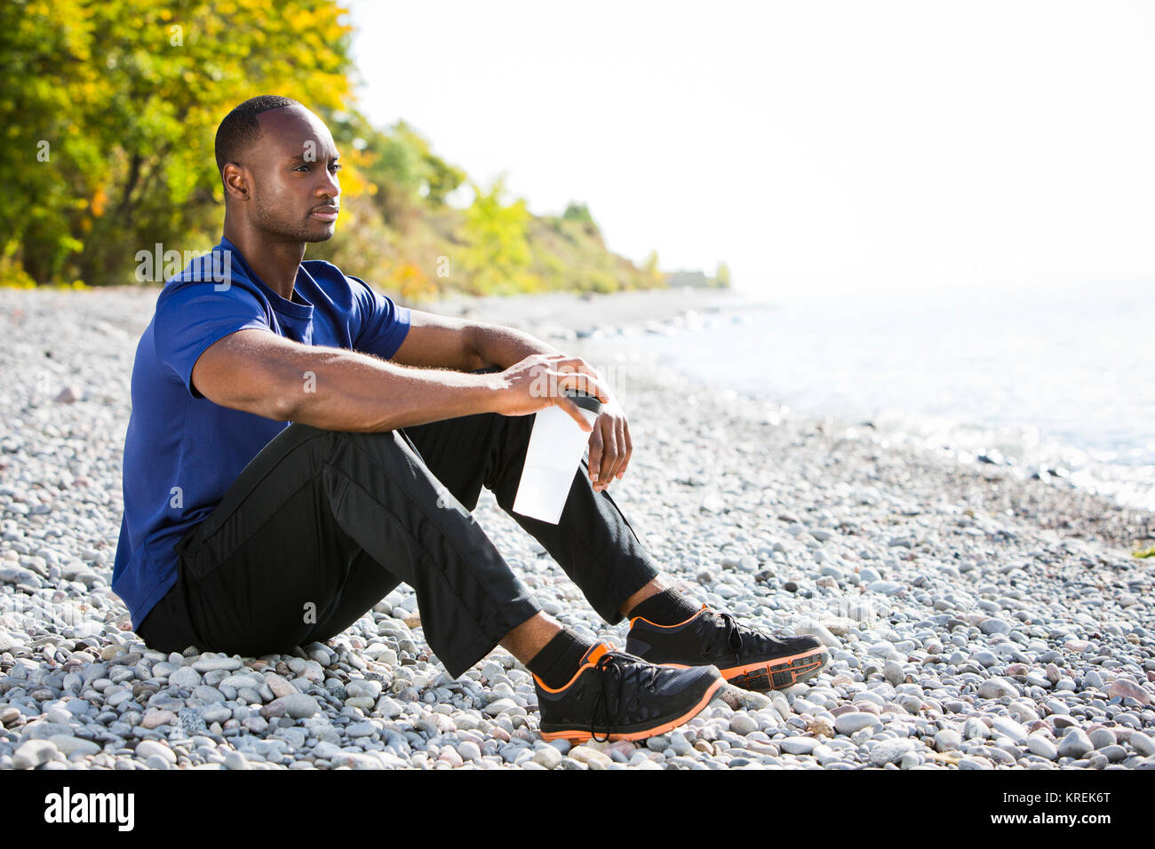 young man relaxing on the beach Stock Photo - Alamy