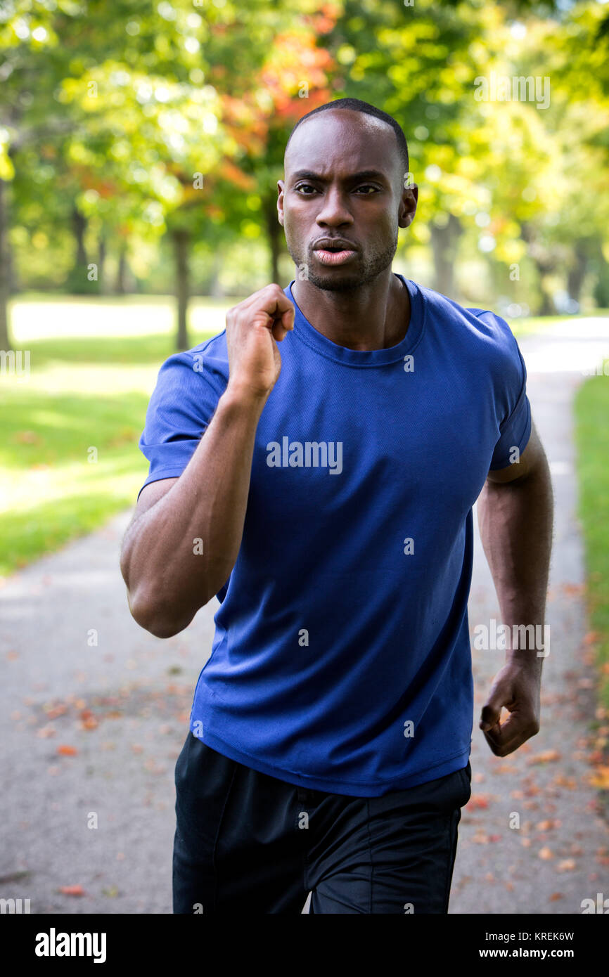 young man running outdoors Stock Photo - Alamy