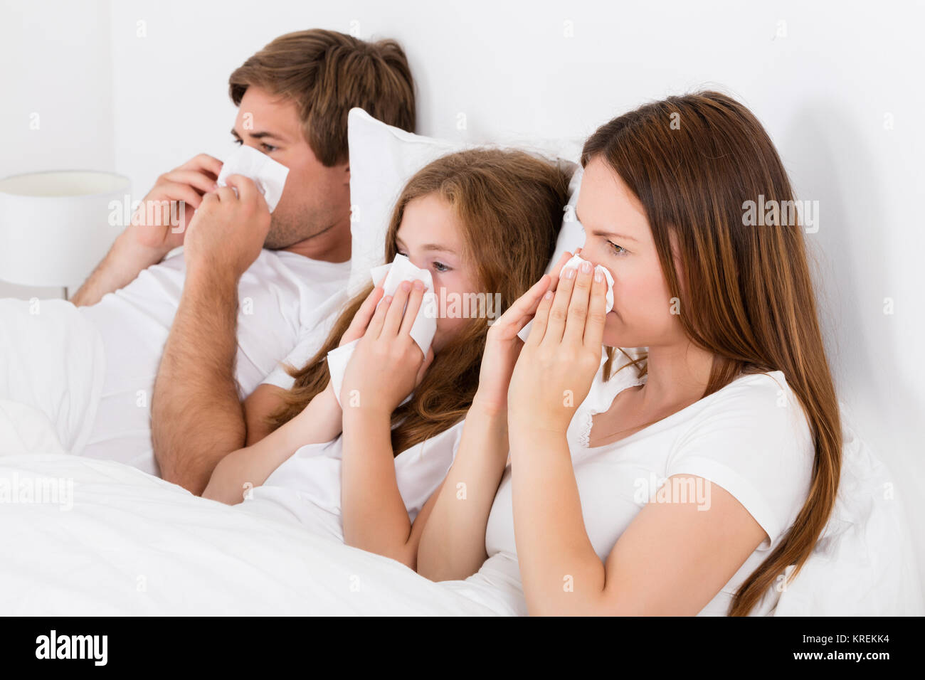 Family Suffering From Cold Stock Photo - Alamy
