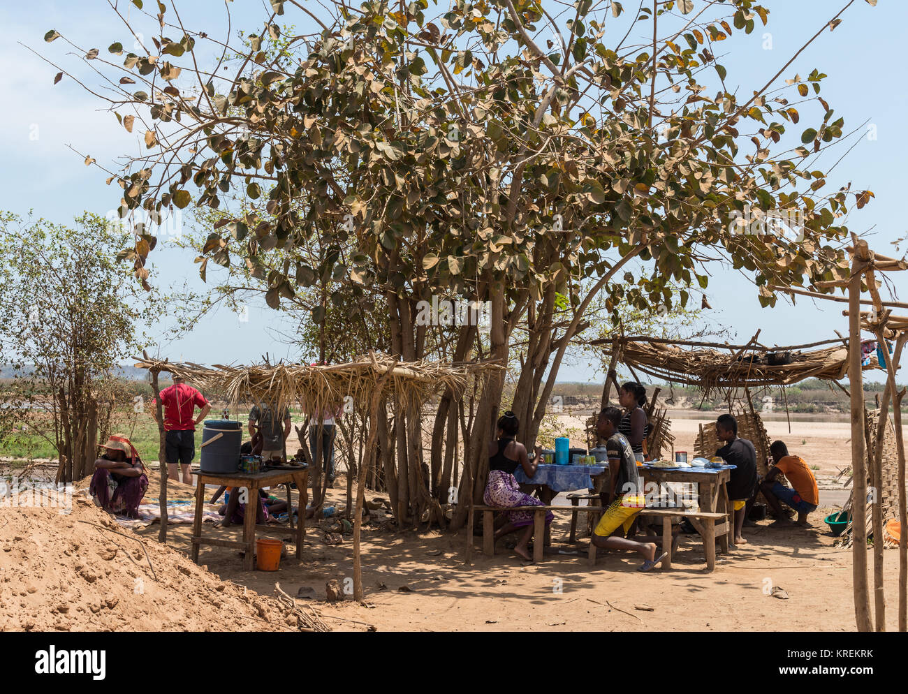 Food stall serving passengers at the ferry port of Mania River ...