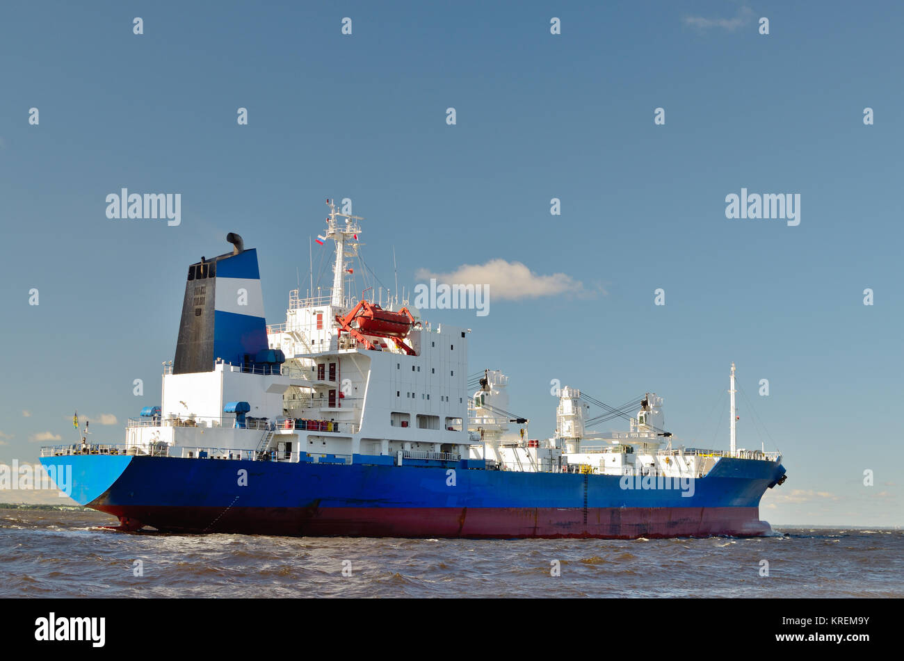 Ship being loaded at the port and now it sails home Stock Photo - Alamy