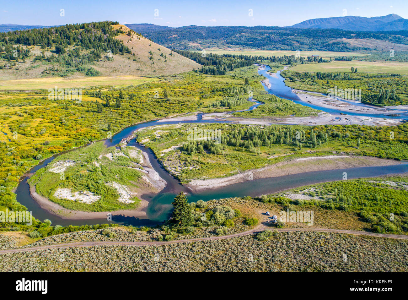 Buffalo Fork winds through the lush green landscape of Grand Tetons ...
