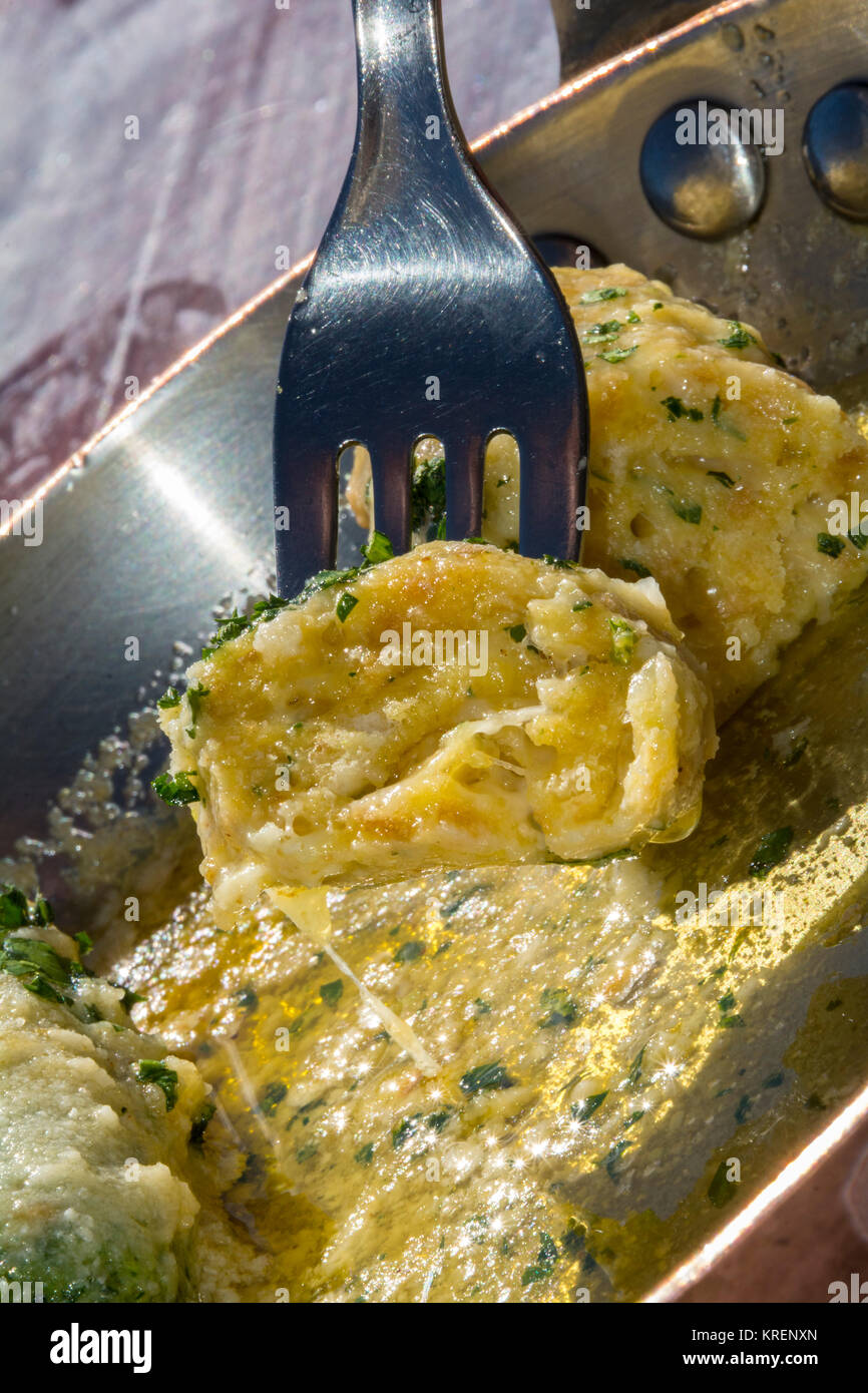 lunch at the alpine hut - spinach cakes and cheese socks Stock Photo ...