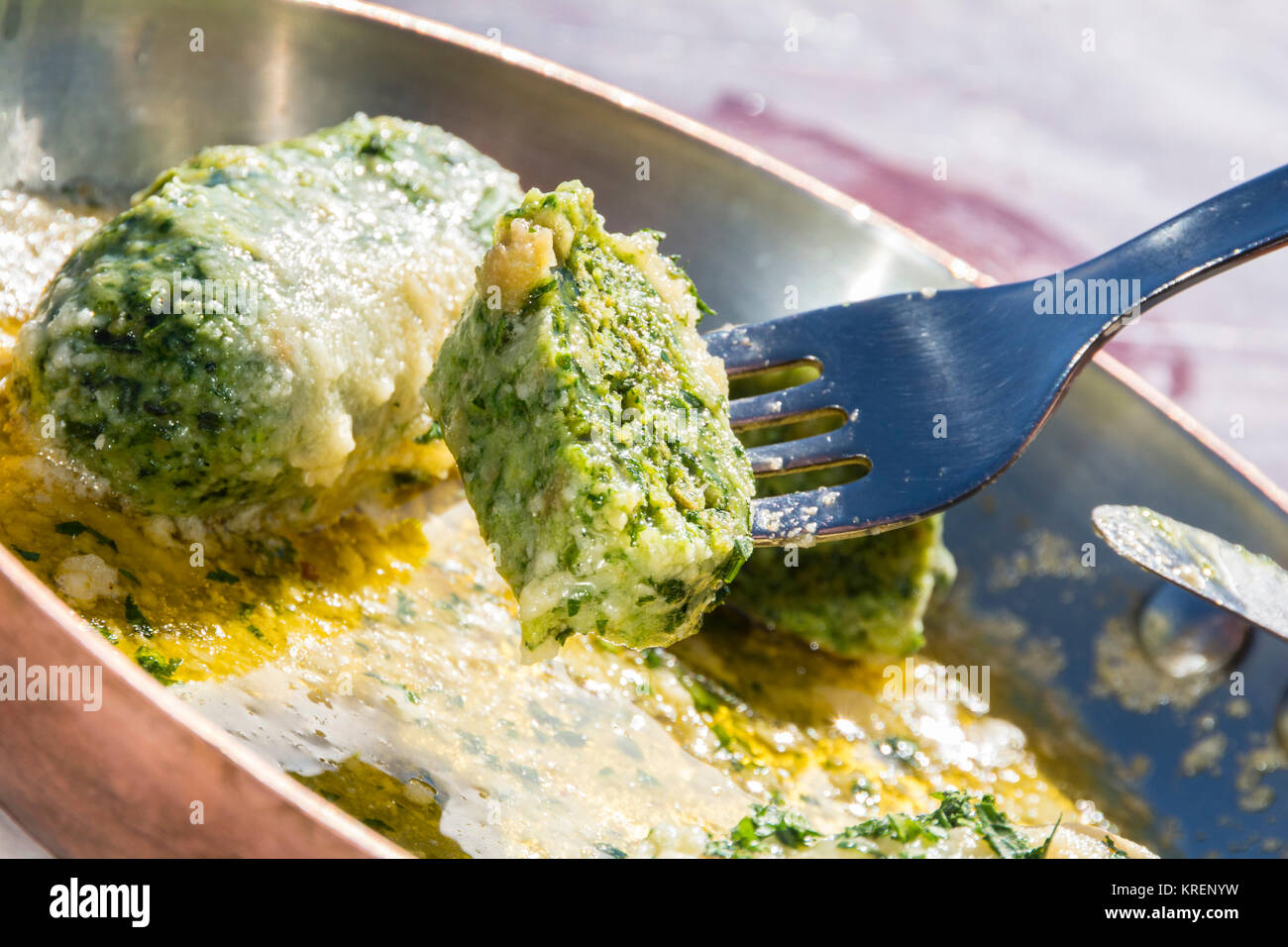 lunch at the alpine hut - spinach cakes and cheese socks Stock Photo ...