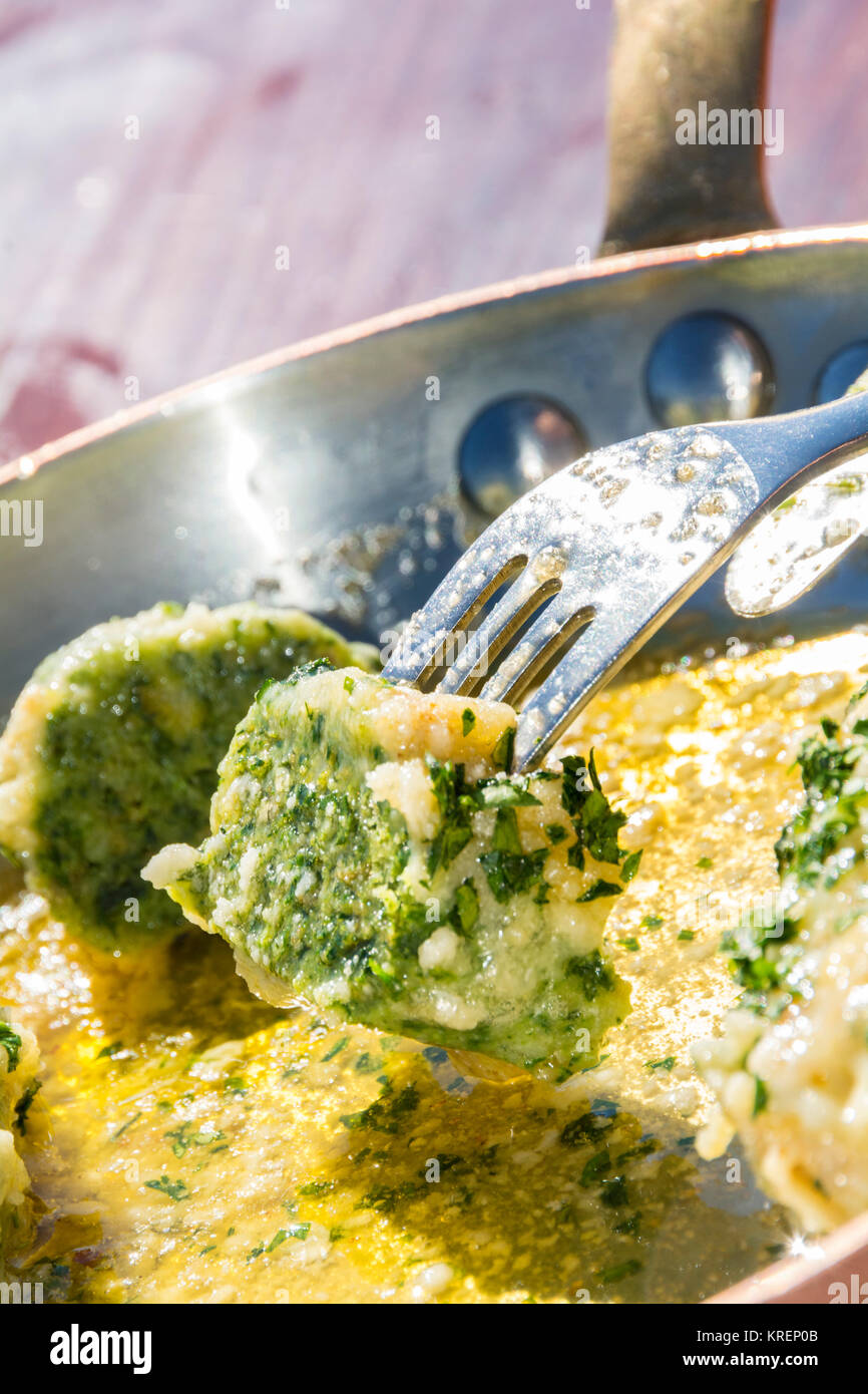 lunch at the alpine hut - spinach cakes and cheese socks Stock Photo ...