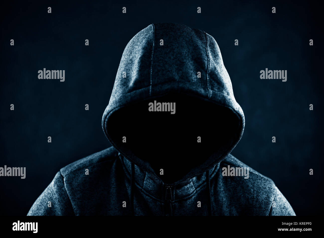 Hooded man in the dark Stock Photo - Alamy