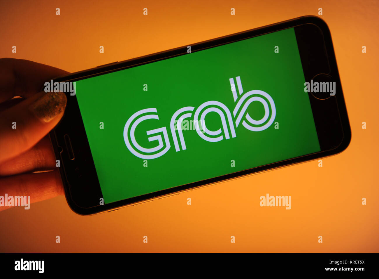 Grab, the ride hailing company logo on a phone Stock Photo - Alamy