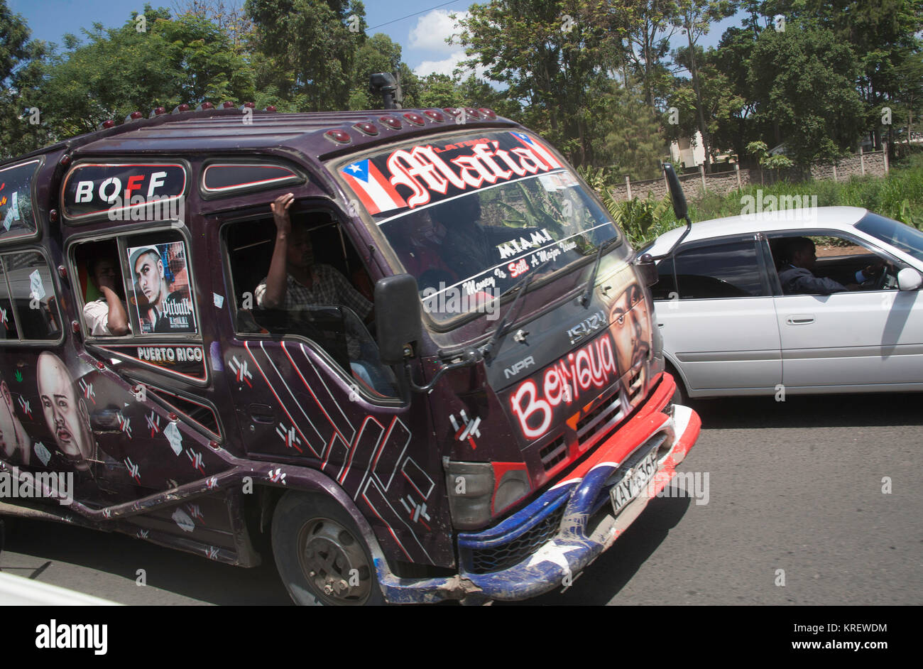 Nairobi's brightly coloured matutu minibuses drive around city centre ...