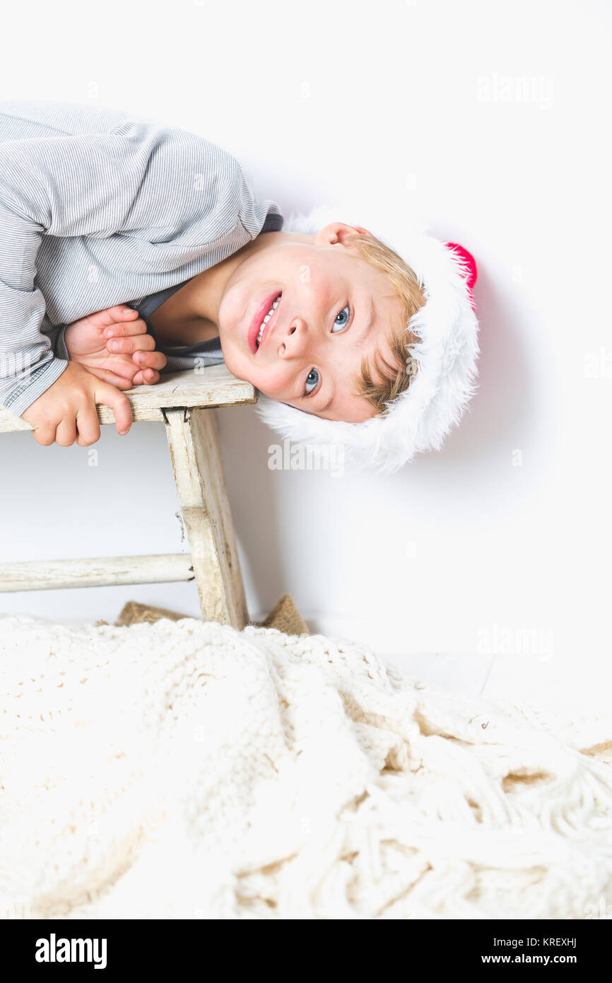 happy christmas boy in santa hat on white background Stock Photo - Alamy