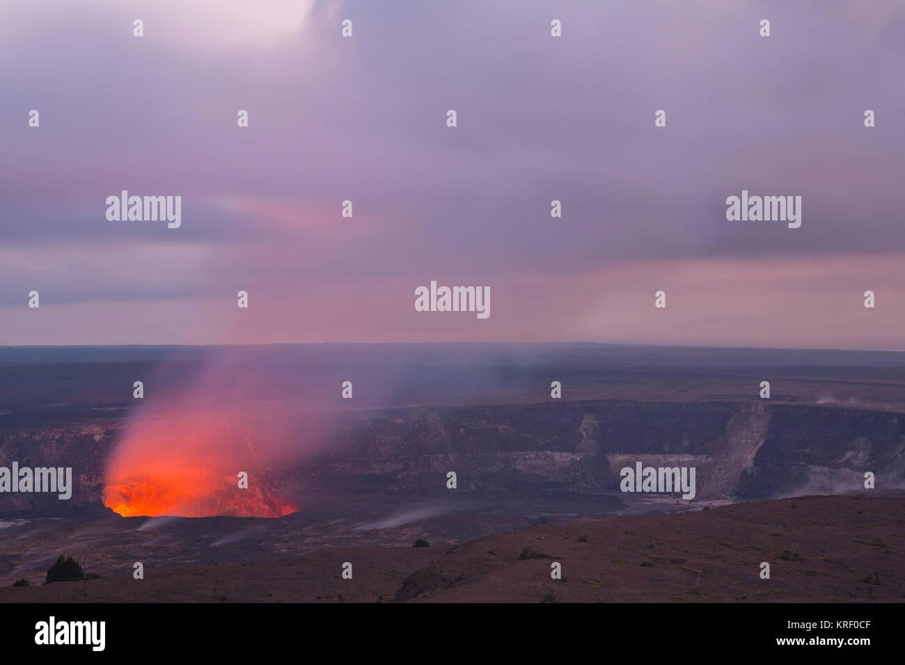 The Kilauea Volcano eruption glows during the blue hour between ...