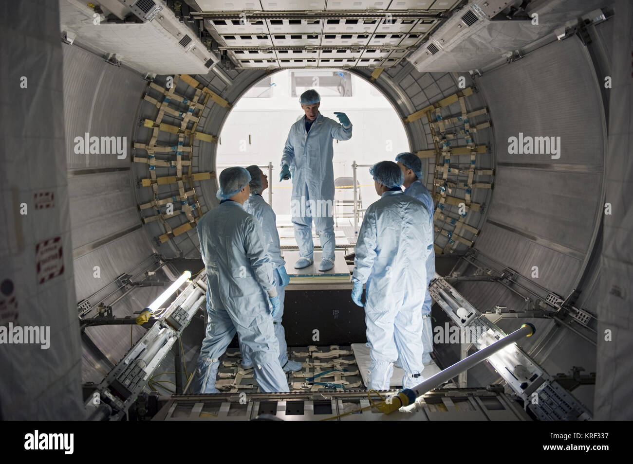 STS-135 crew inspects the Raffaello multi-purpose logistics module ...